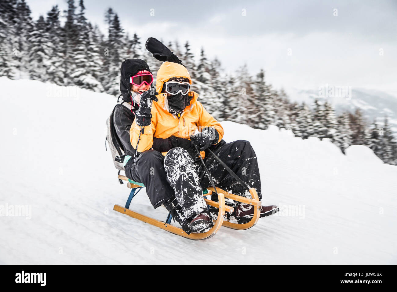 Adult sledging mountain hi-res stock photography and images - Alamy