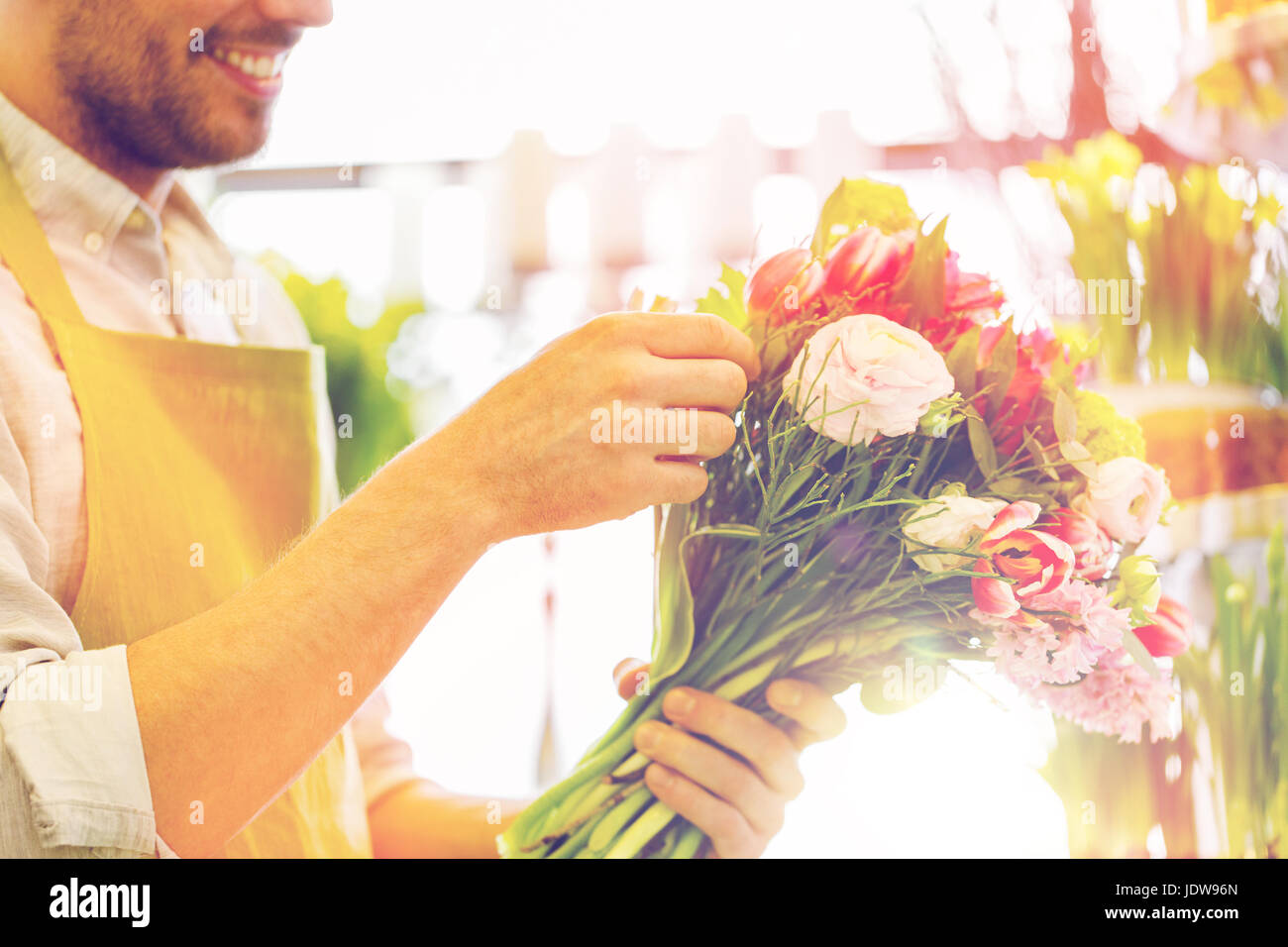 close up of florist man with bunch at flower shop Stock Photo - Alamy