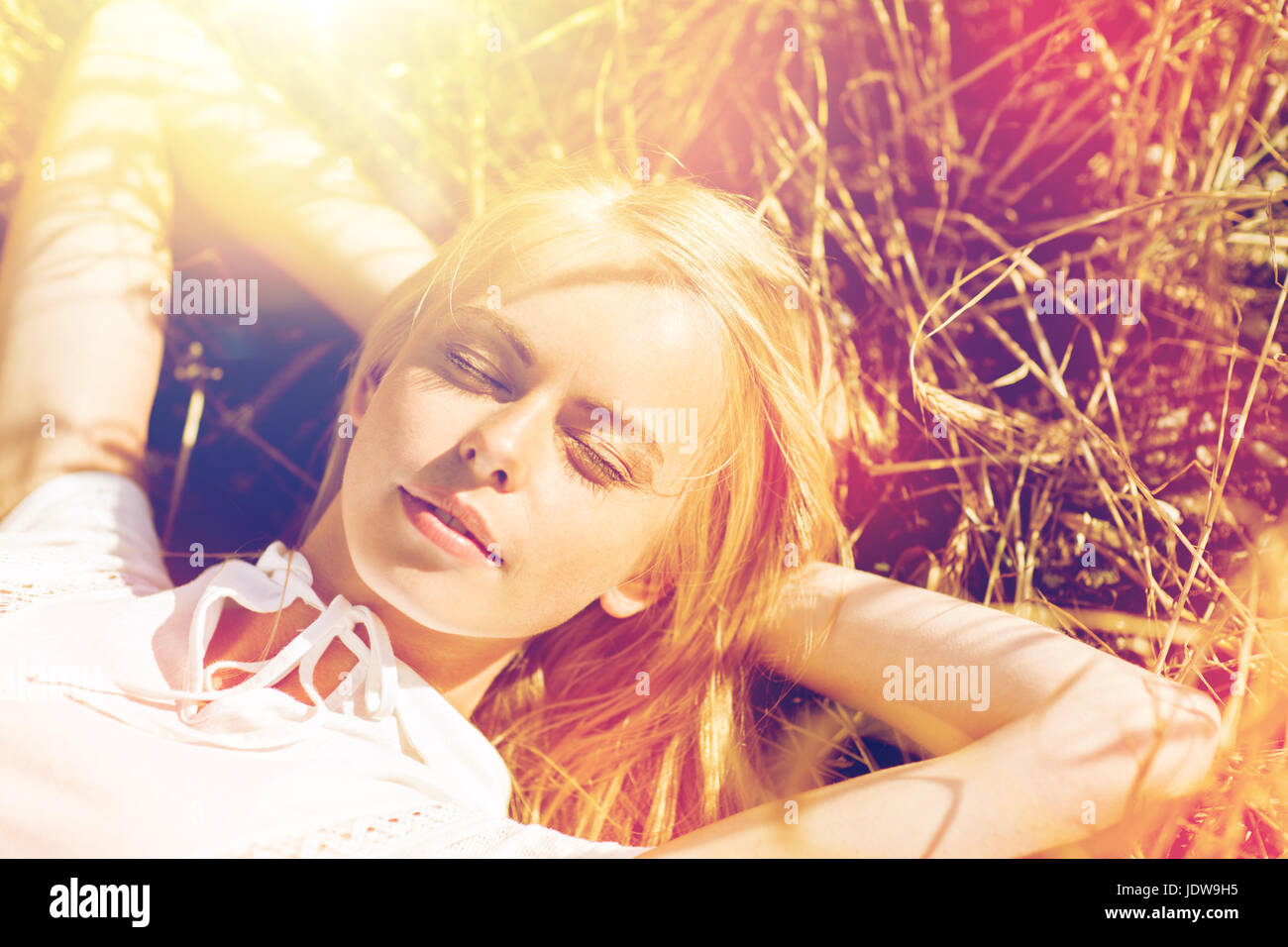 Teen girl lying on field hi-res stock photography and images - Alamy