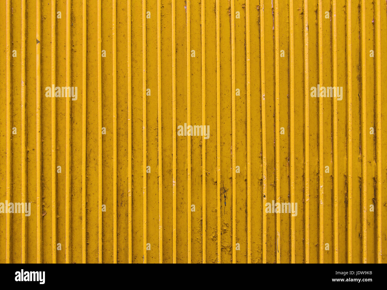 old yellow painted metal ribbed surface Stock Photo - Alamy