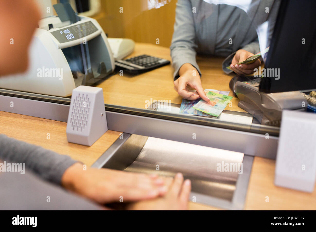 clerk counting cash money at bank office Stock Photo - Alamy