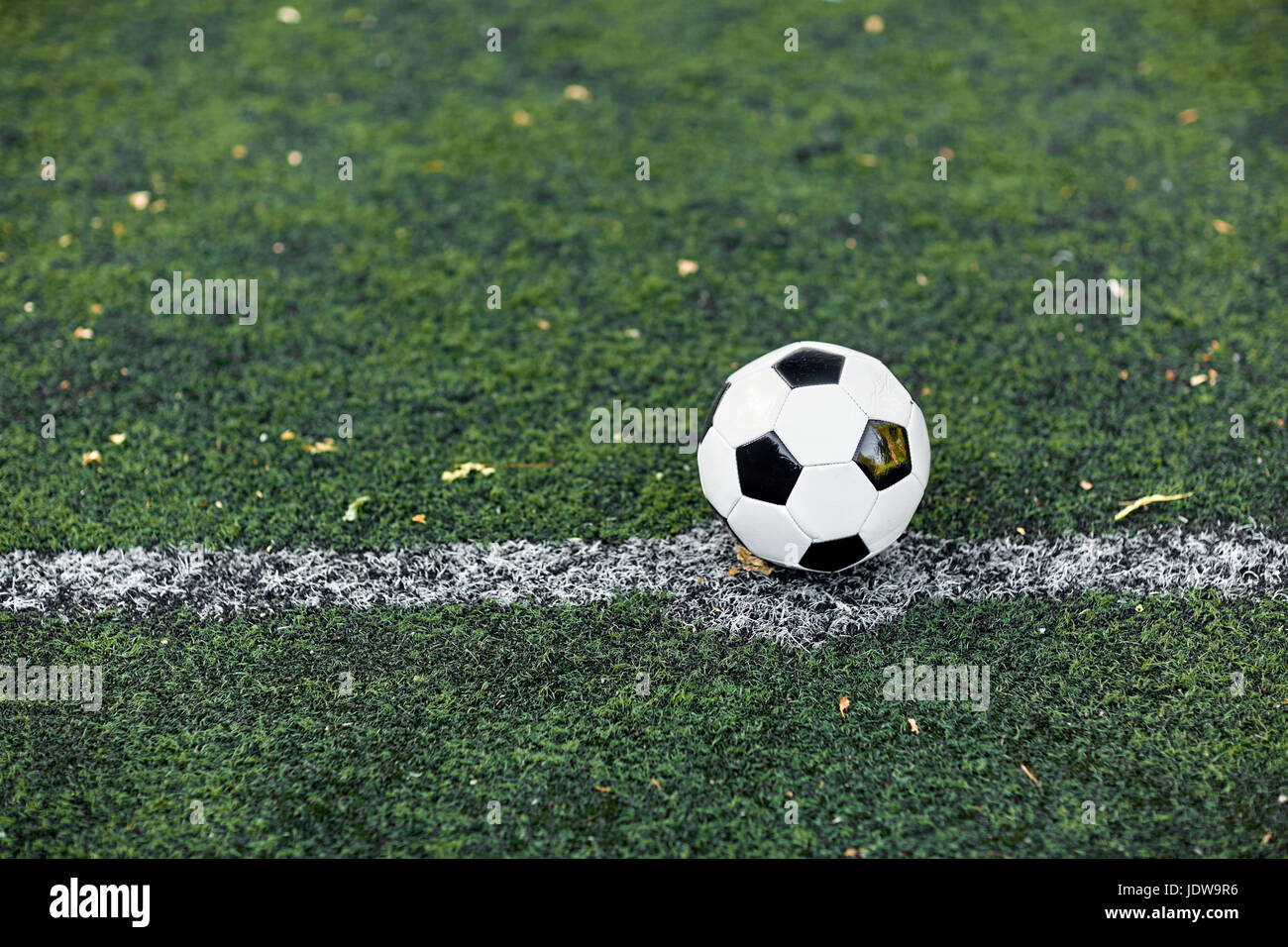 soccer ball on football field marking line Stock Photo - Alamy