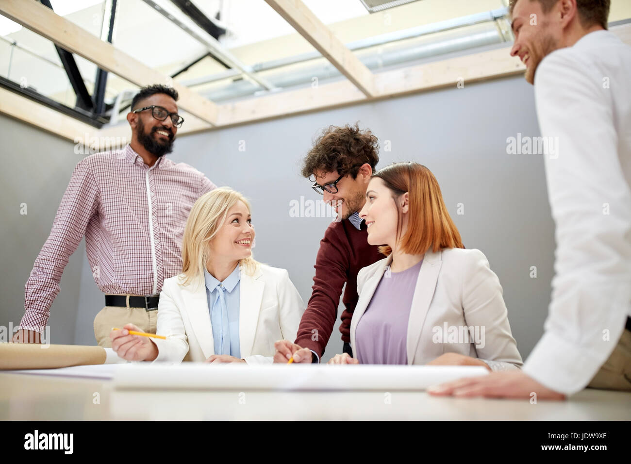 business team with blueprint project at office Stock Photo - Alamy