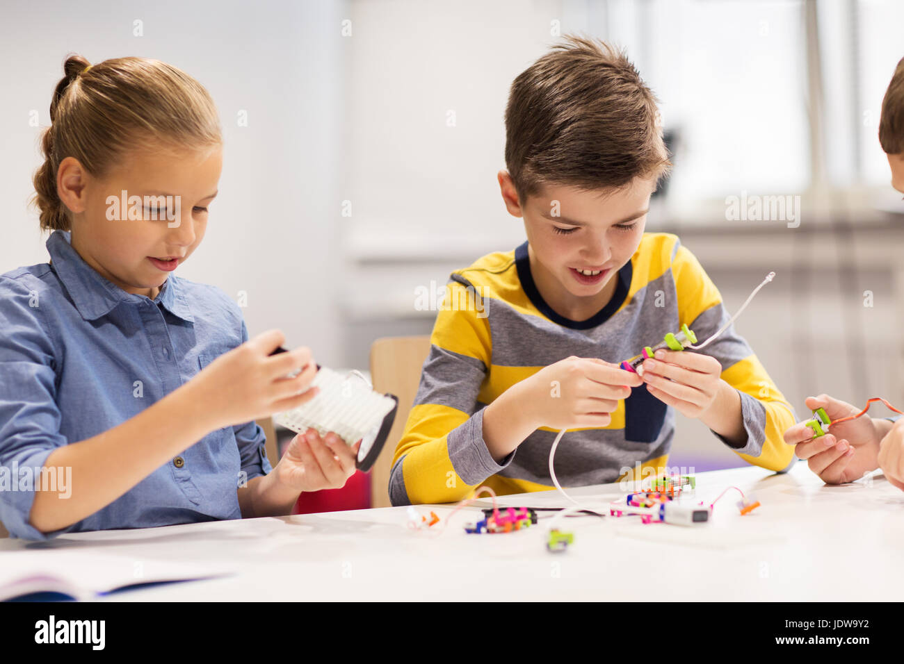 happy children building robots at robotics school Stock Photo - Alamy