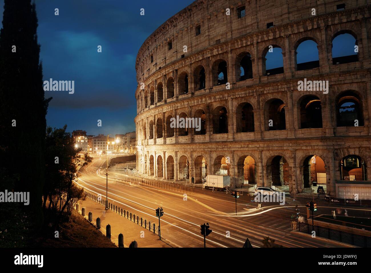 Colosseum at night with light trail in Rome, Italy Stock Photo - Alamy