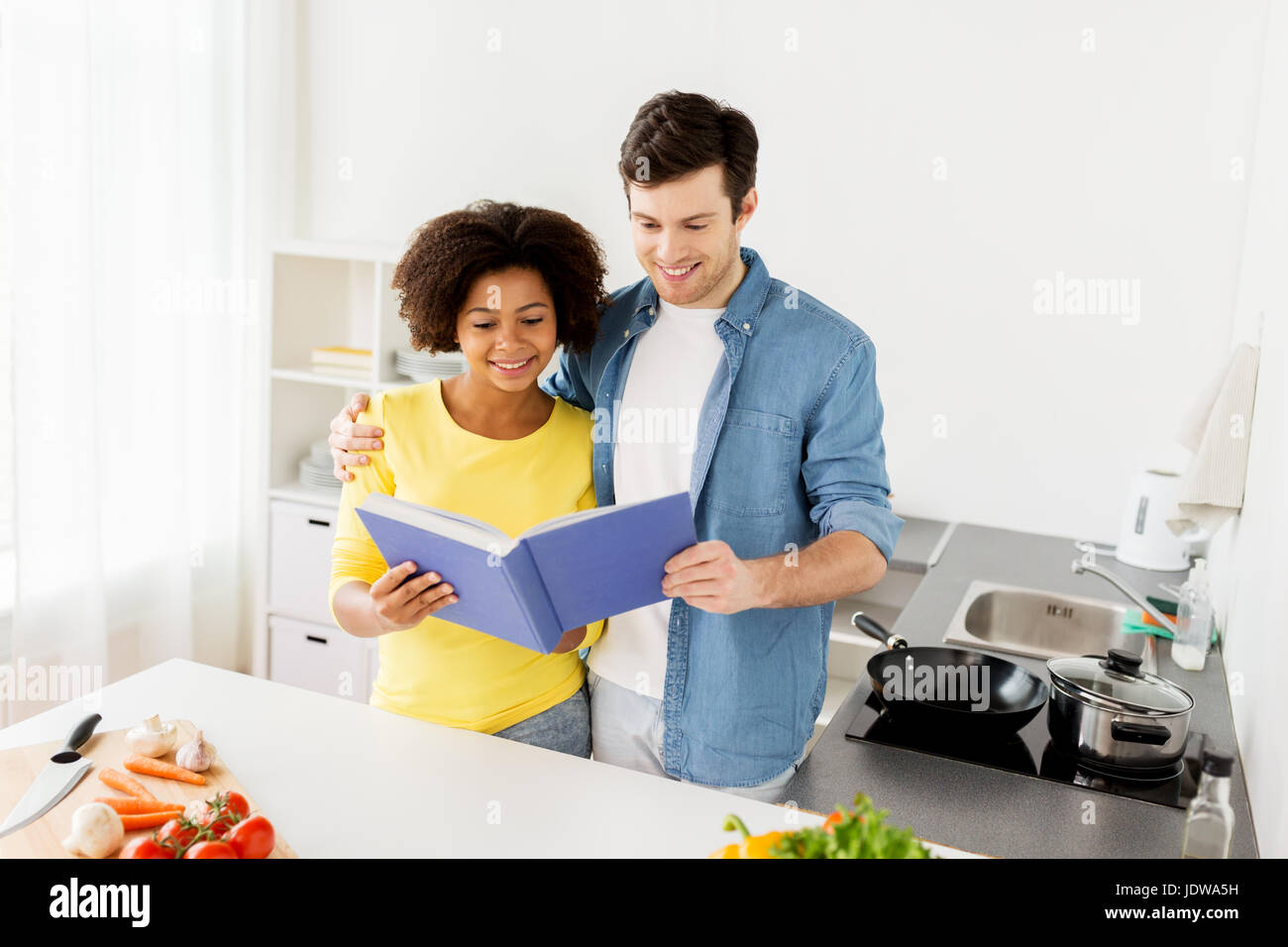 Couple cooking book hi-res stock photography and images - Alamy