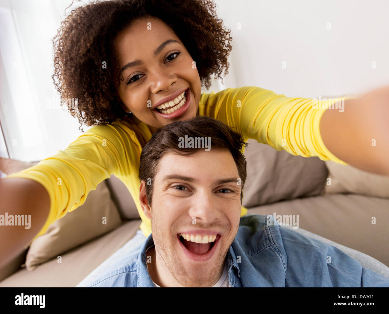 happy multiethnic couple taking selfie at home Stock Photo - Alamy happy multiethnic couple taking selfie at home Stock Photo - Alamy
