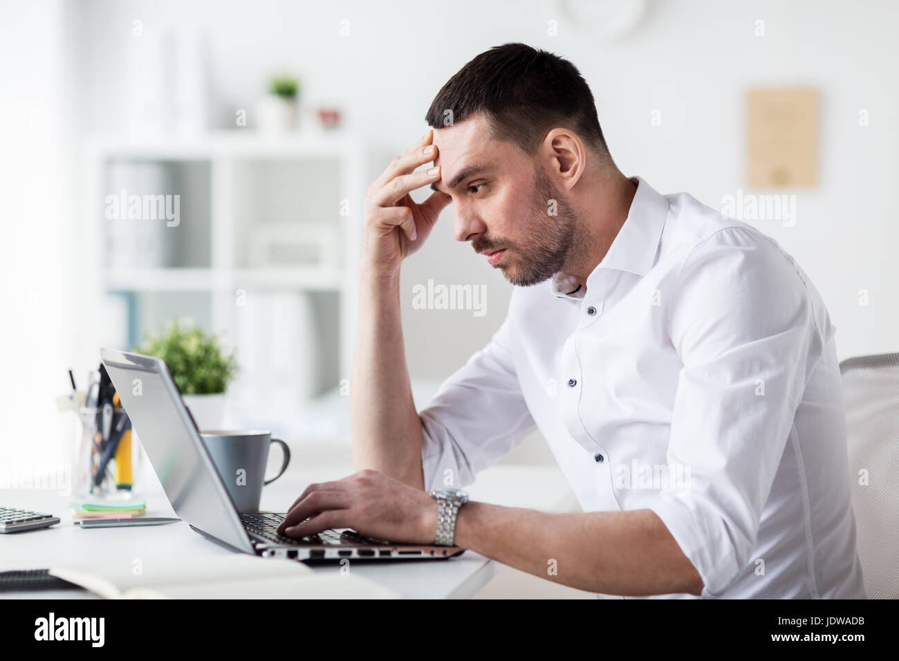 stressed businessman with laptop at office Stock Photo - Alamy
