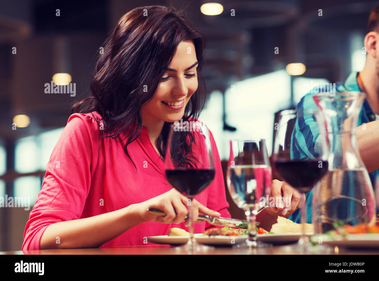happy woman having dinner at restaurant Stock Photo - Alamy