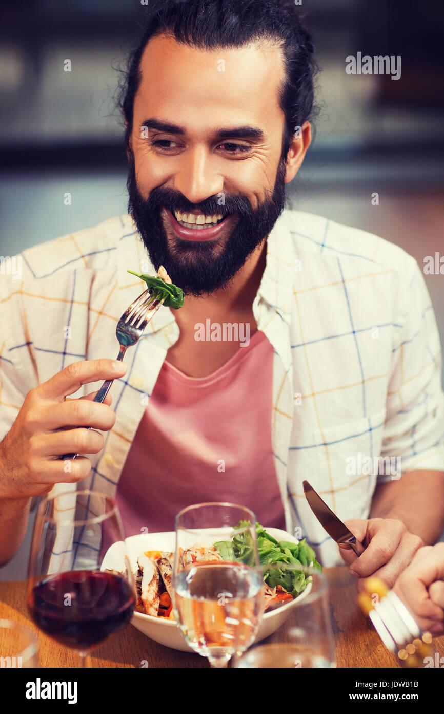 happy man having dinner at restaurant Stock Photo - Alamy