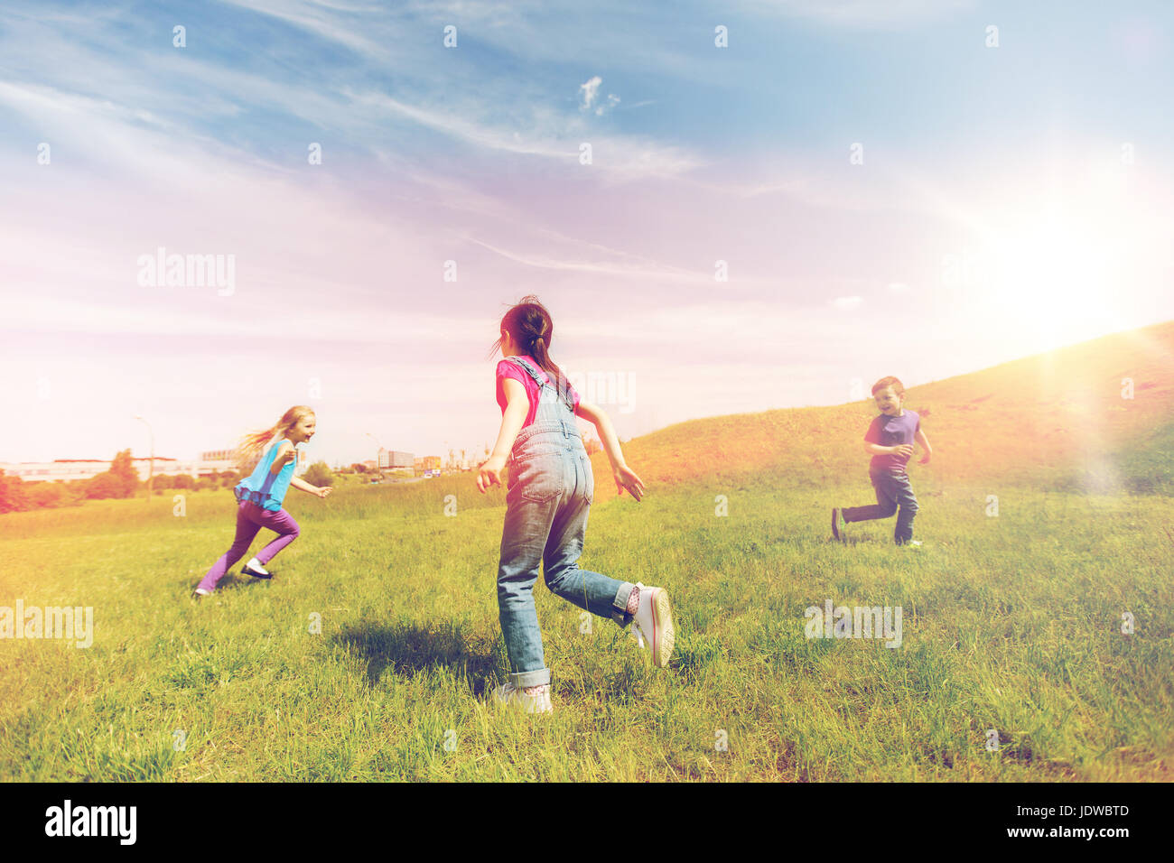 group of happy kids running outdoors Stock Photo - Alamy