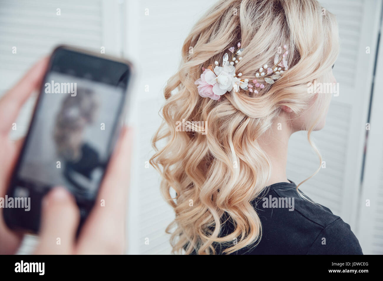 Hair stylist takes pictures of the prepared styling Stock Photo - Alamy