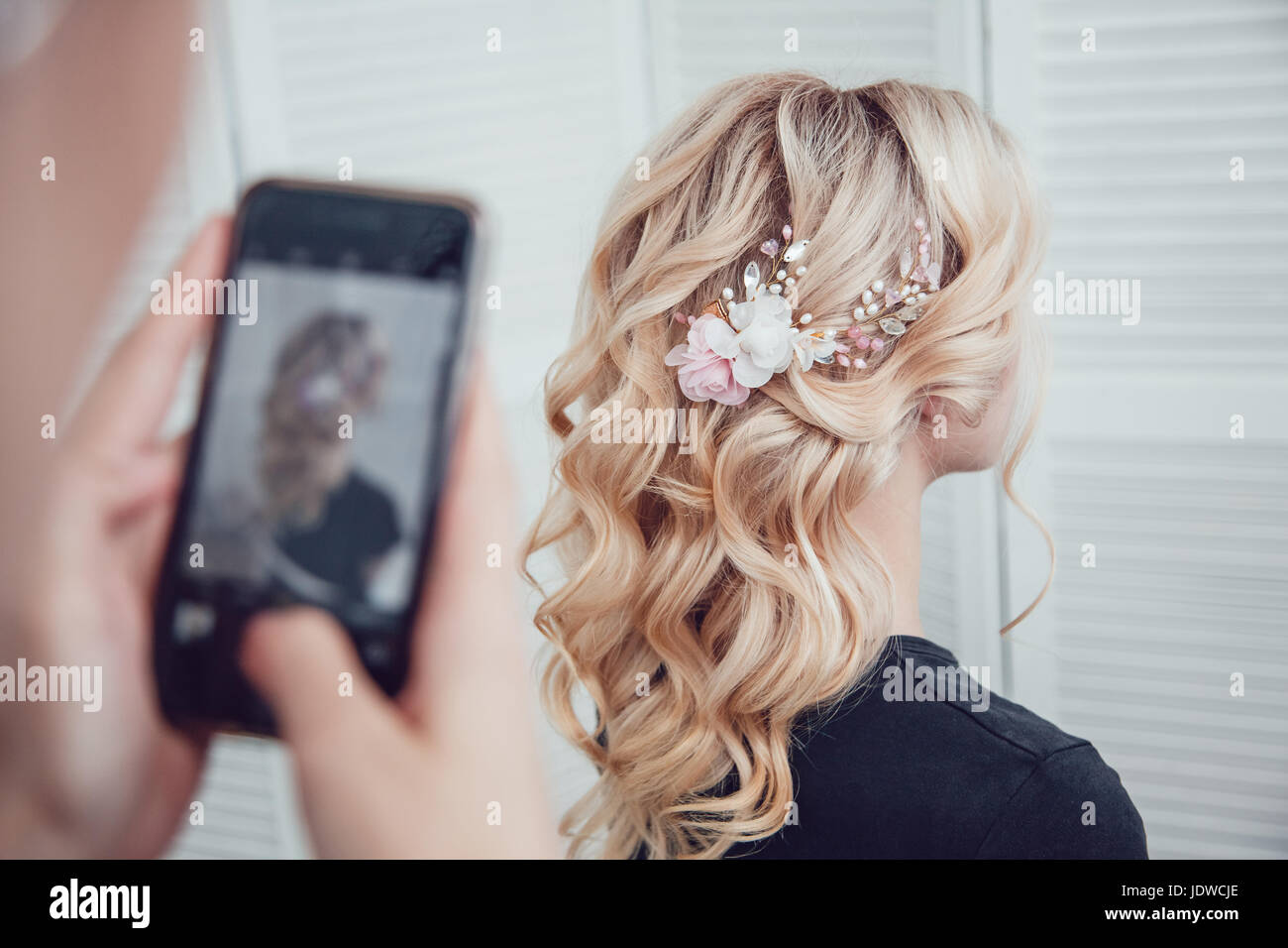 Hair stylist takes pictures of the prepared styling Stock Photo - Alamy