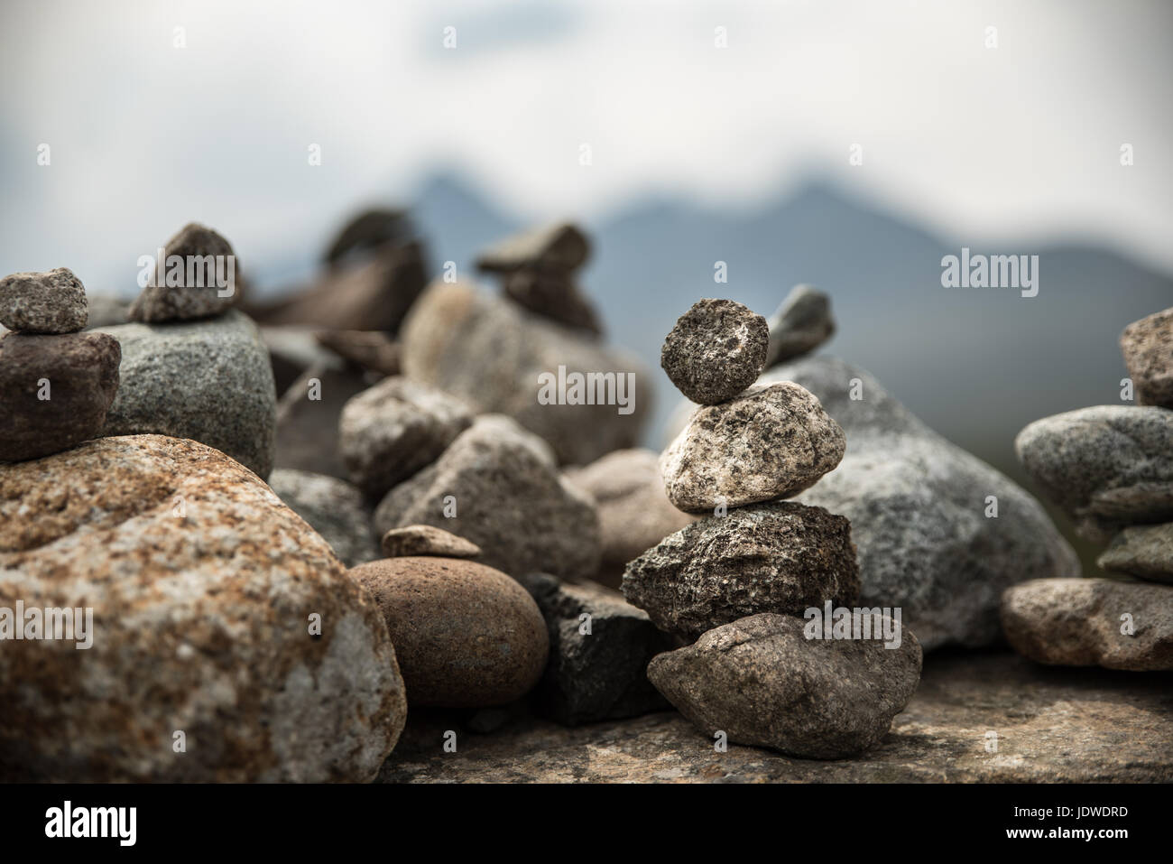 Stone towers by touristic paths in scotland. Mountains in background ...