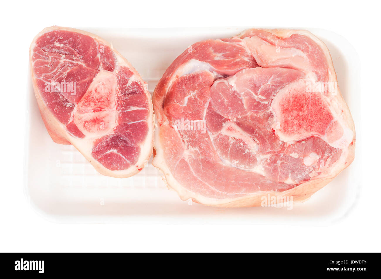 Pork knuckle in a plastic container isolated on white background. Top ...