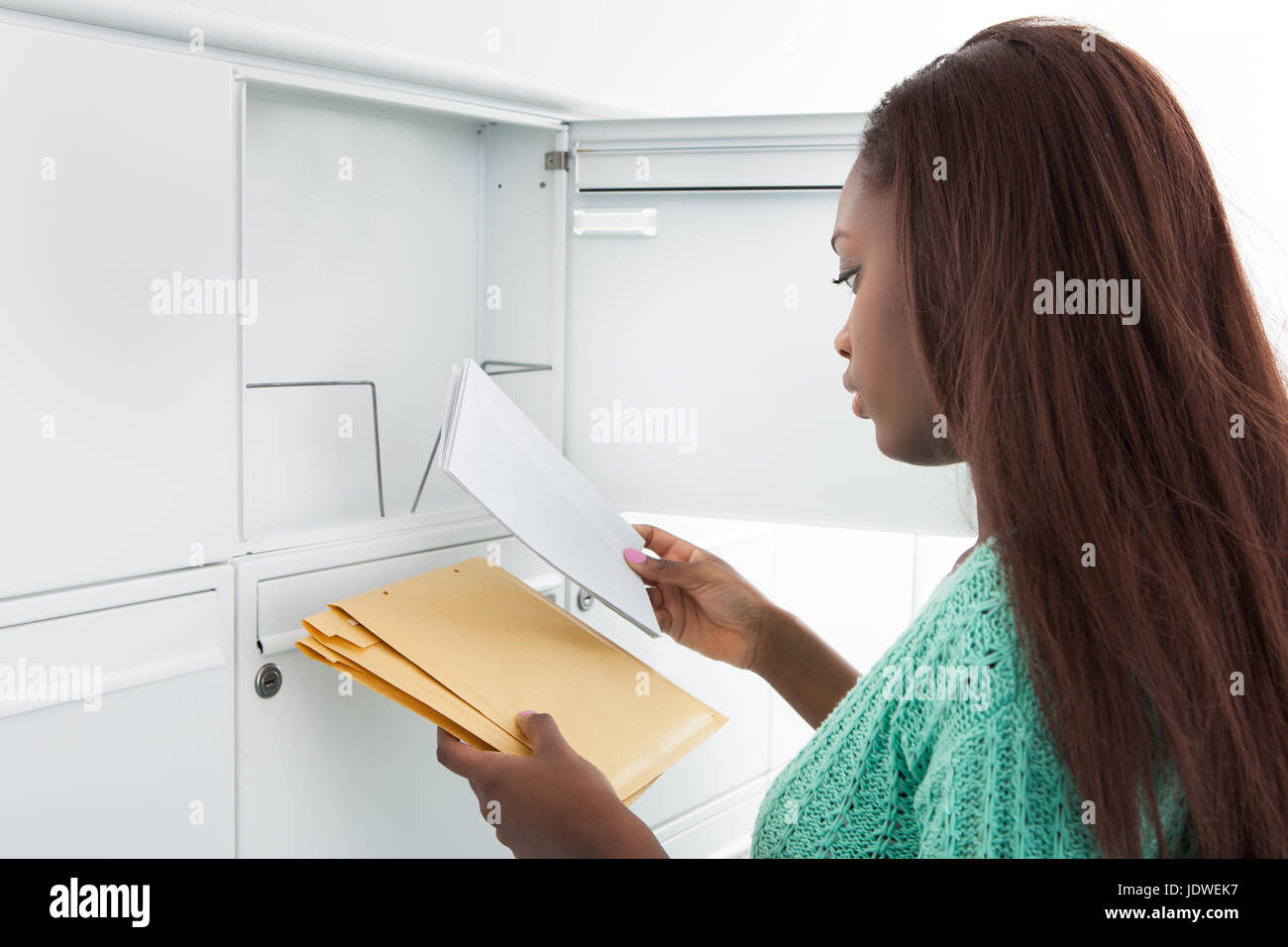 Close-up Of Woman Getting Letters From Mailbox Stock Photo - Alamy