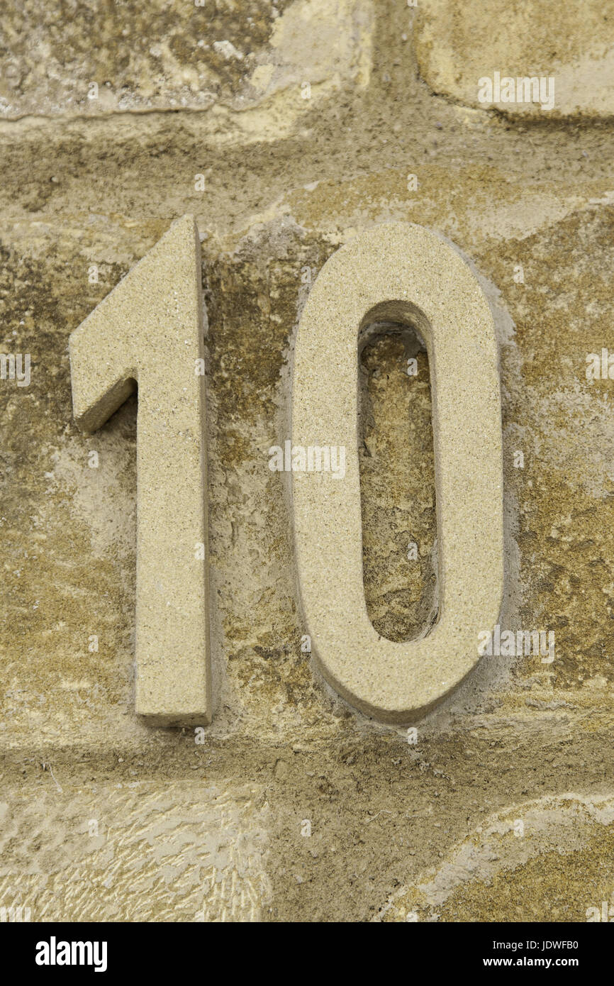 Number ten of stone, detail of a couple of information Stock Photo - Alamy