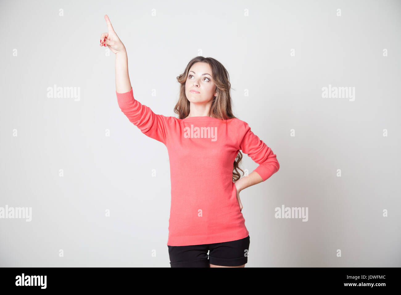 beautiful girl shows the direction of the hand 1 Stock Photo - Alamy