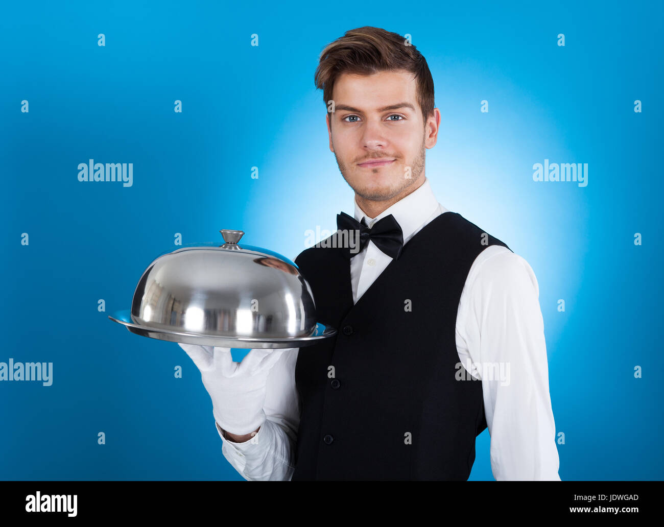 Butler carrying silver serving tray hi-res stock photography and images ...