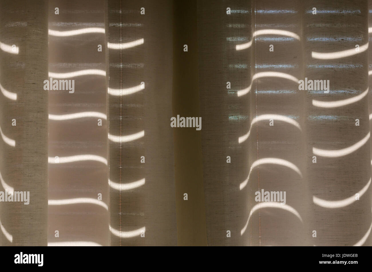 Sunlight through shutters and curtains Stock Photo - Alamy