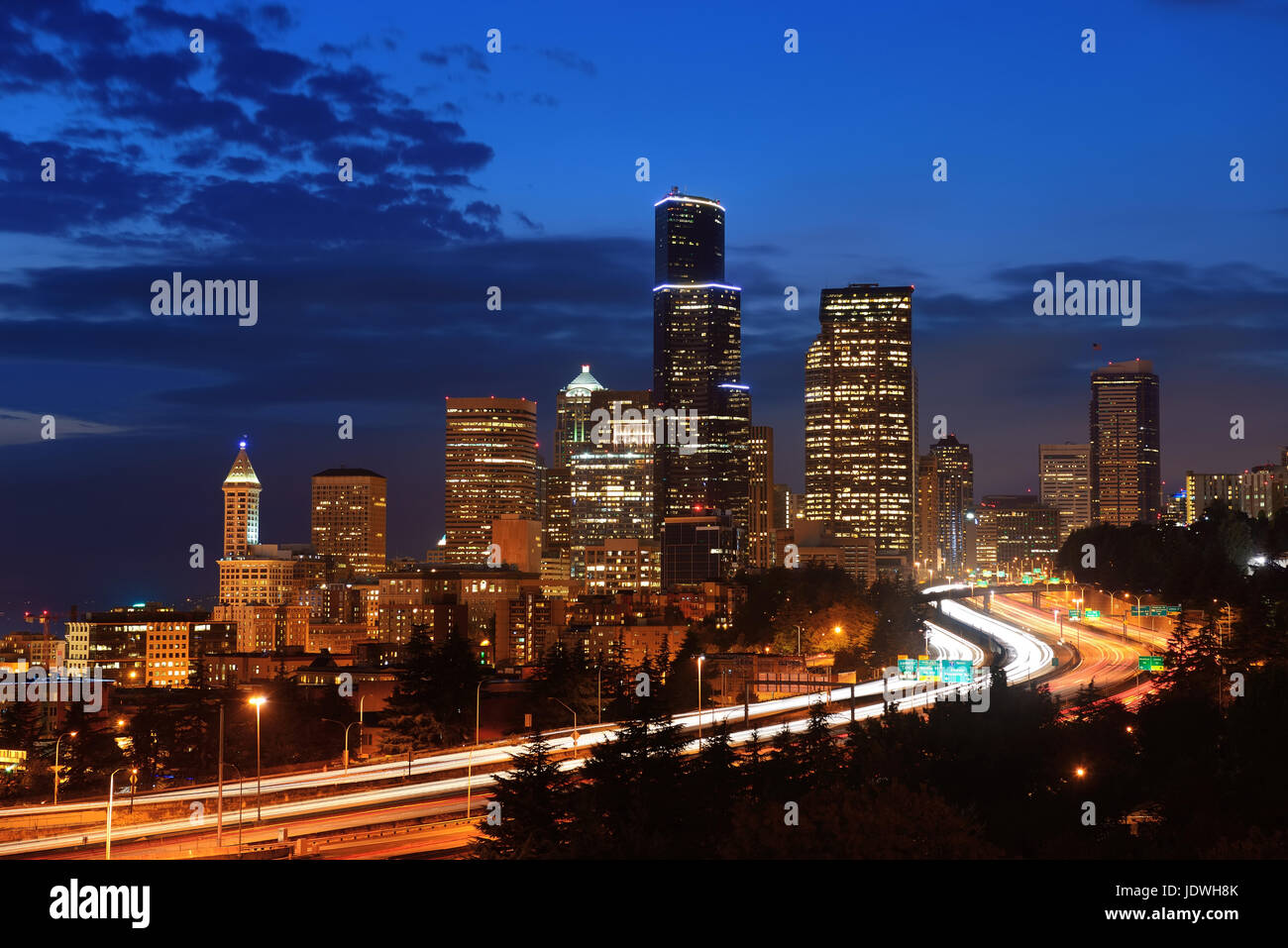 Seattle city view with urban architecture and traffic light trail at ...