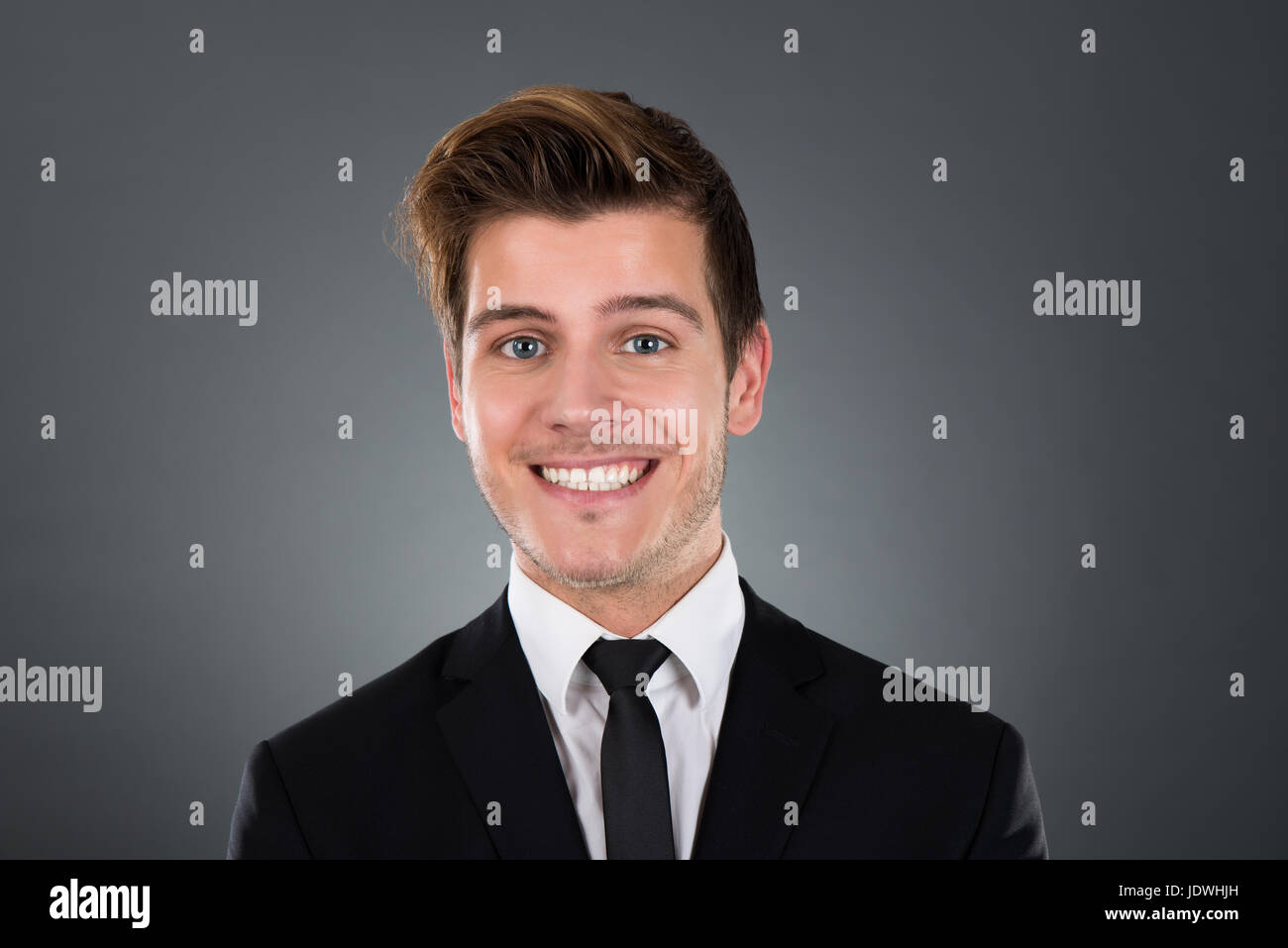 Portrait of confident young businessman isolated over gray background ... Portrait of confident young businessman isolated over gray background ...