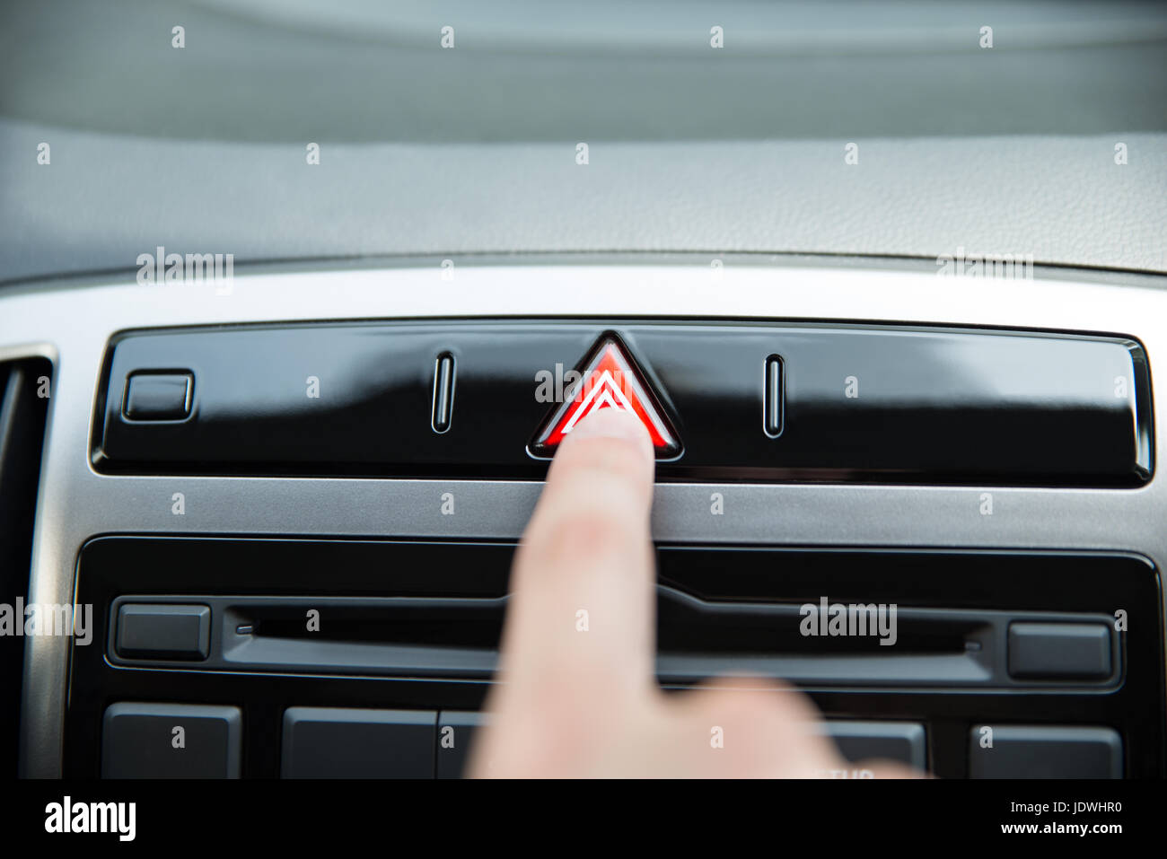 Closeup of man's hand pressing emergency stop button in car Stock Photo ...