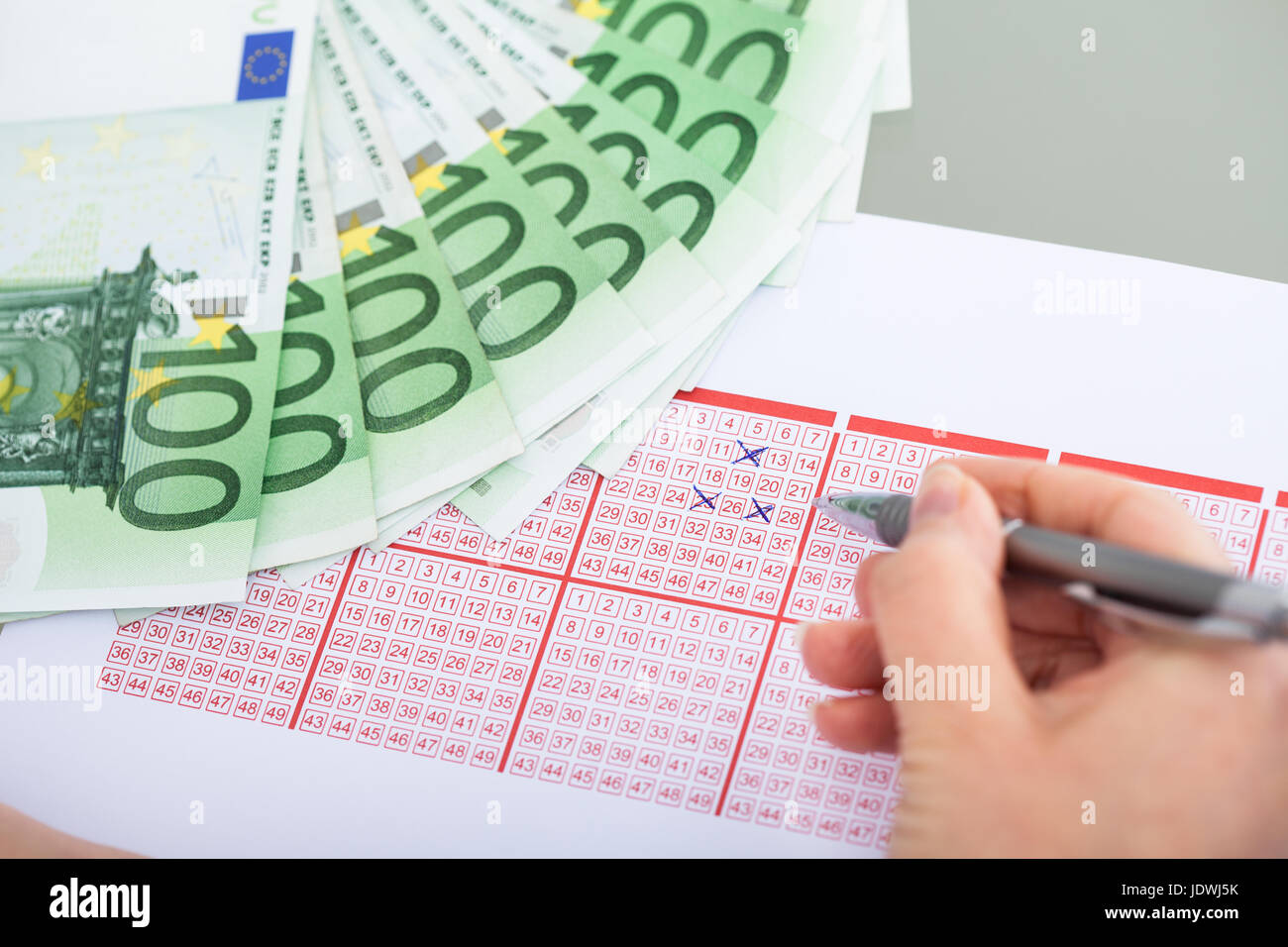 Close-up Of Hand Marking With Pen On Lottery Ticket And Banknote Stock ...