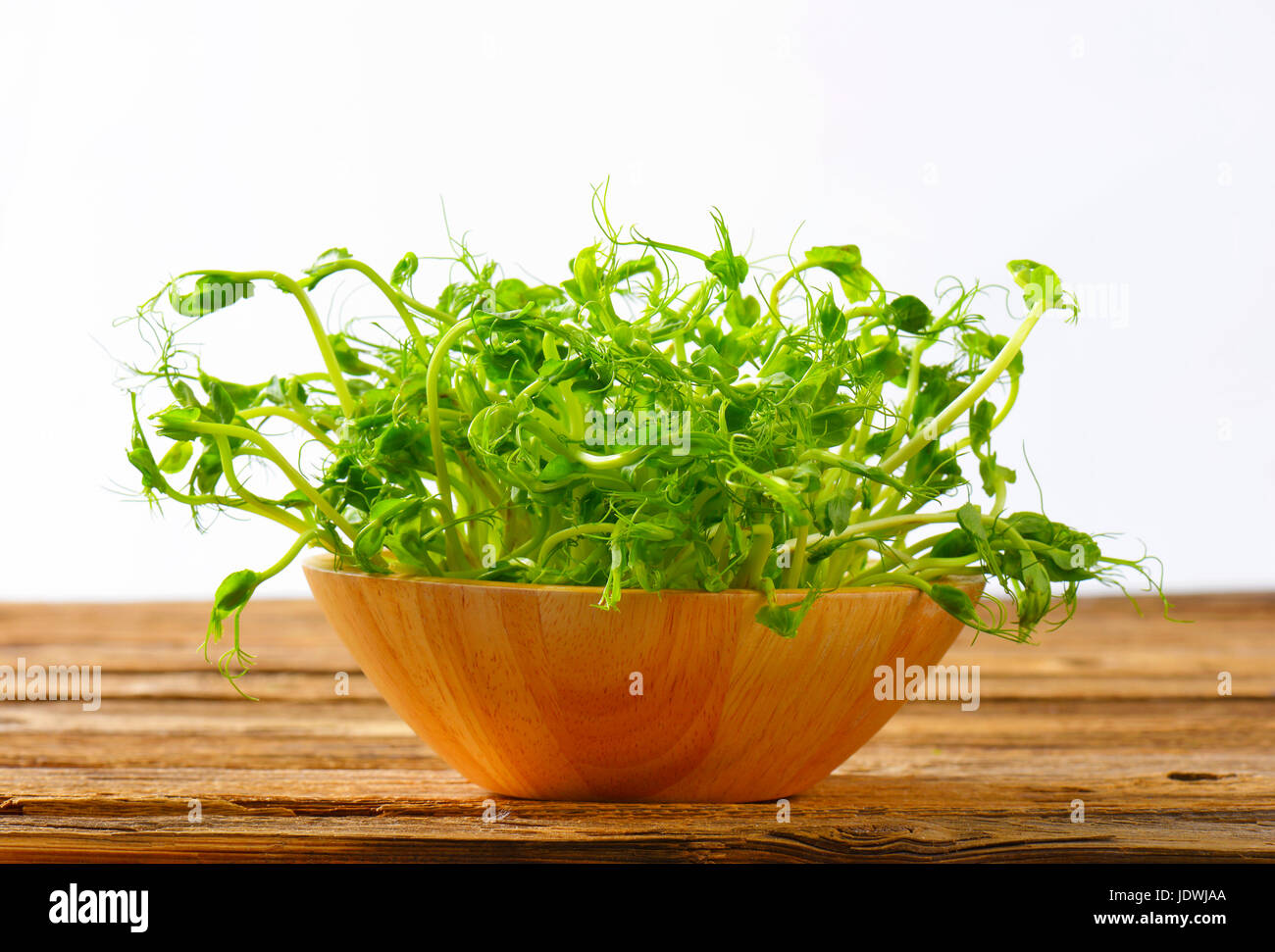 Bowl of green pea sprouts Stock Photo - Alamy