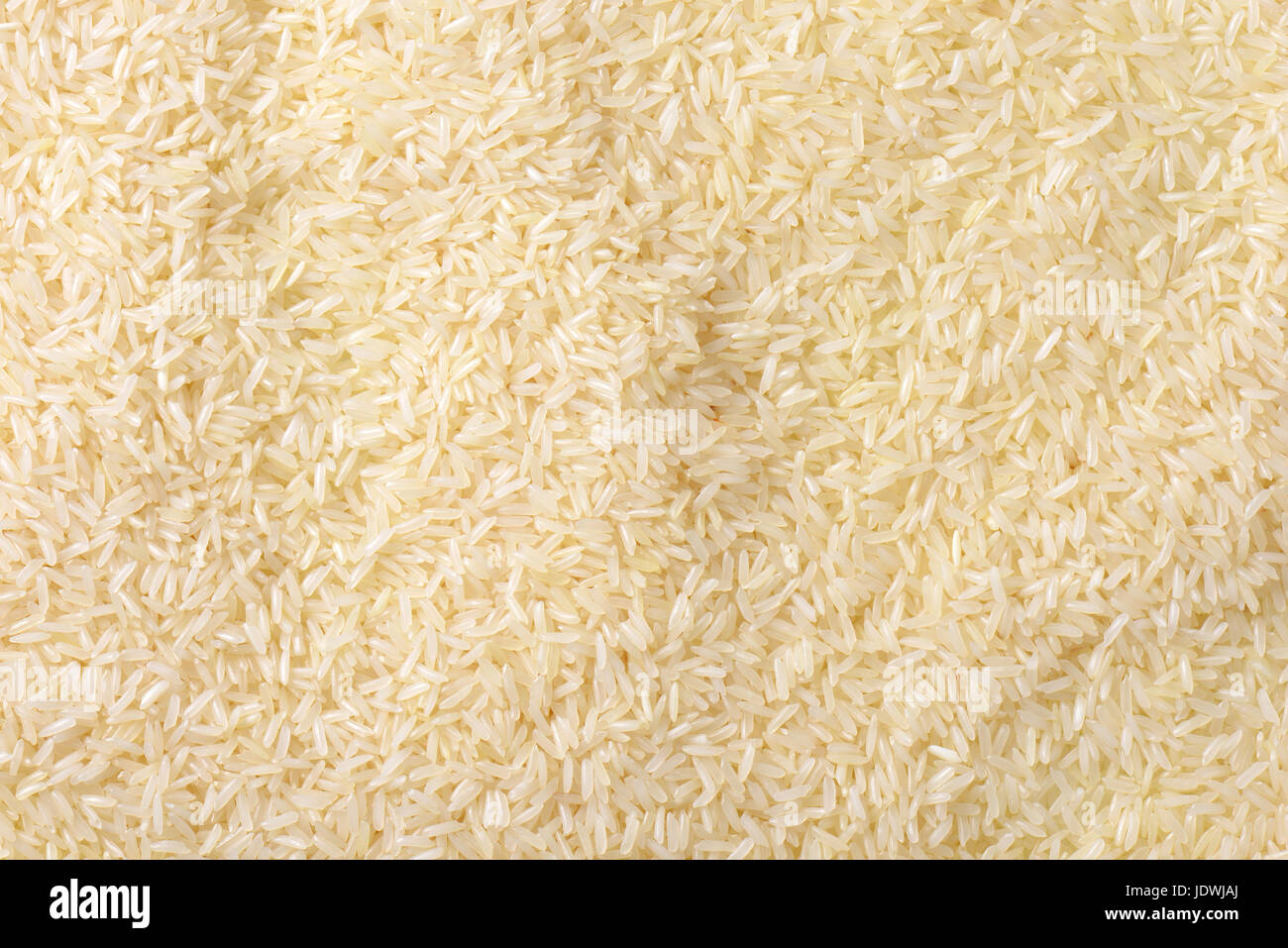 Uncooked Thai Jasmine rice - full frame Stock Photo - Alamy