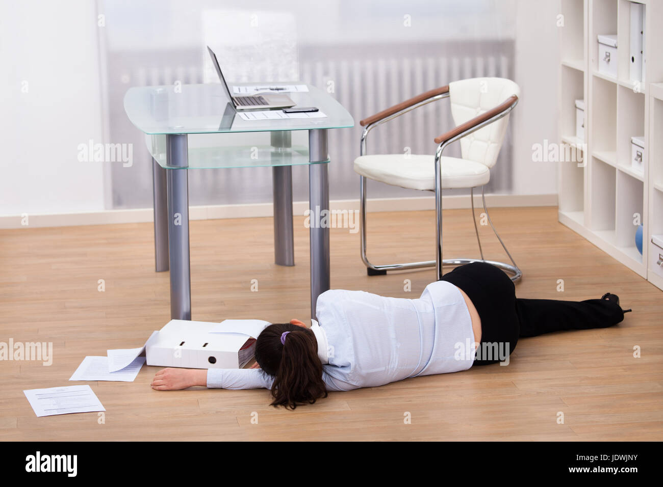 Exhausted Businesswoman Fainted On Floor At Workplace Stock Photo - Alamy