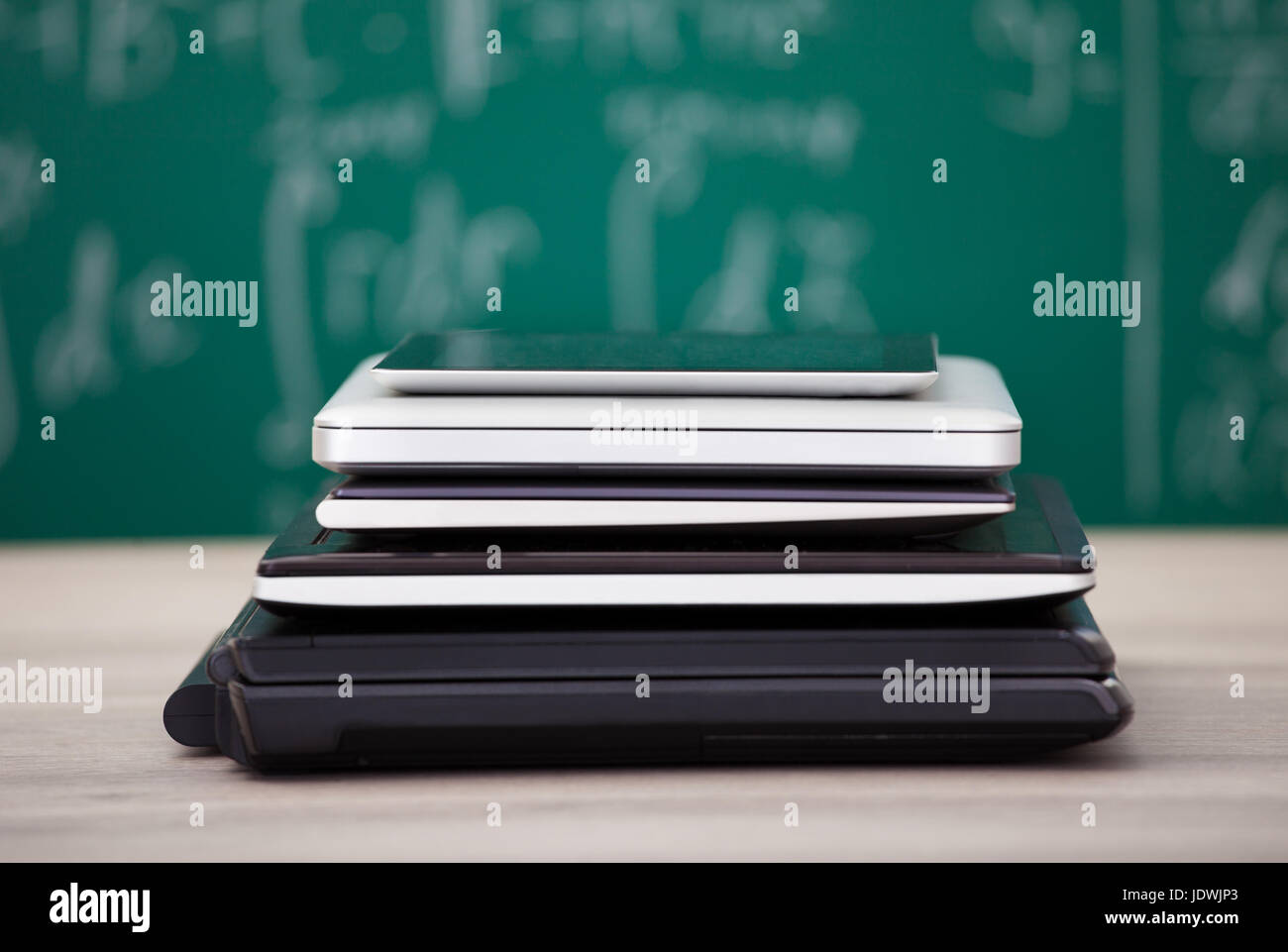 Stack Of Electronic Device Placed On Desk Stock Photo - Alamy