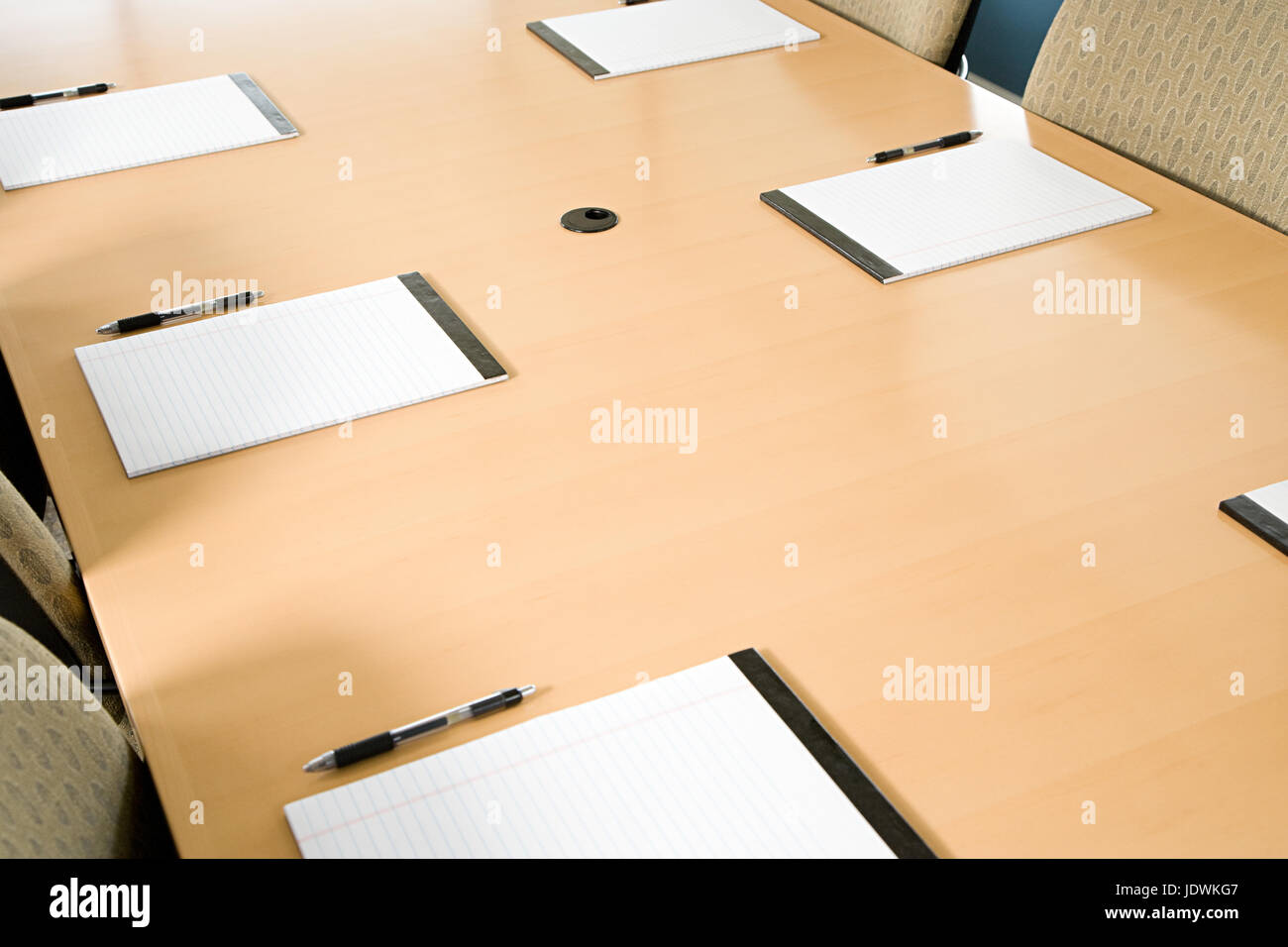 Notepads on conference table Stock Photo - Alamy