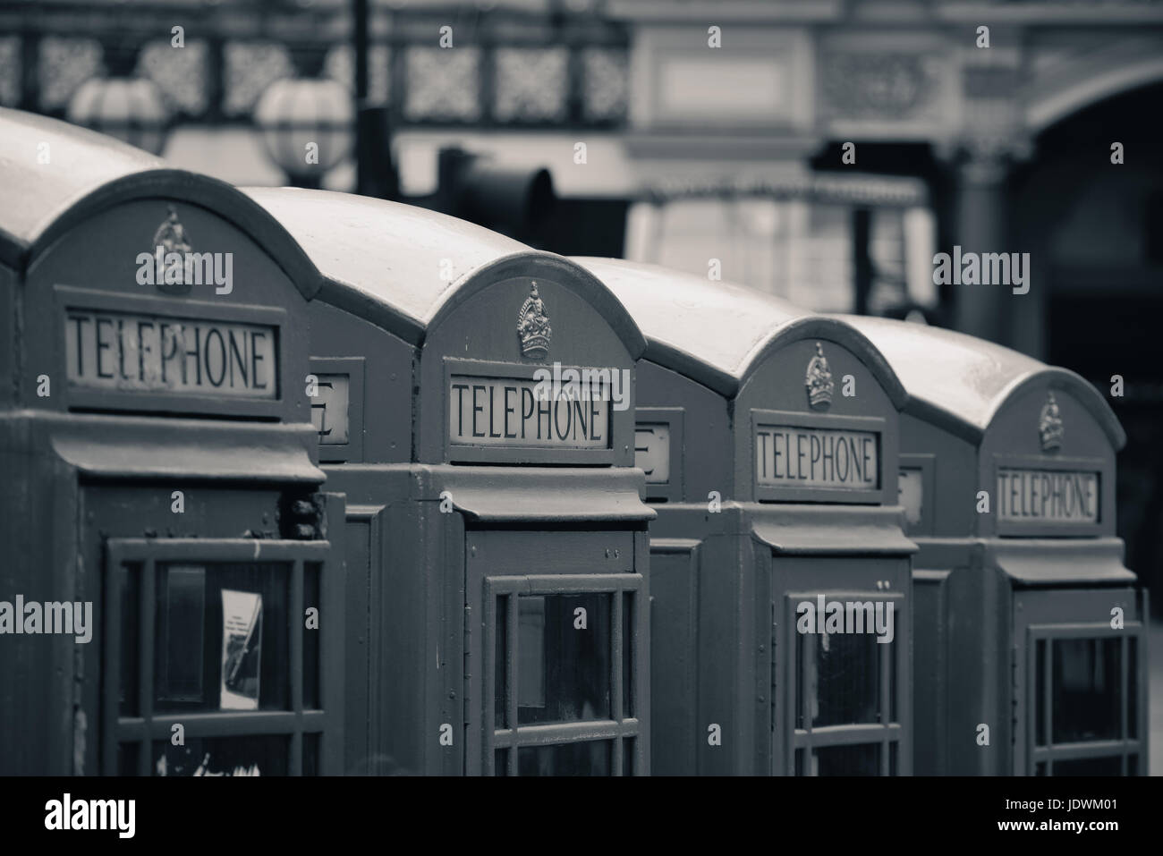Telephone box in street with historical architecture in London in black ...