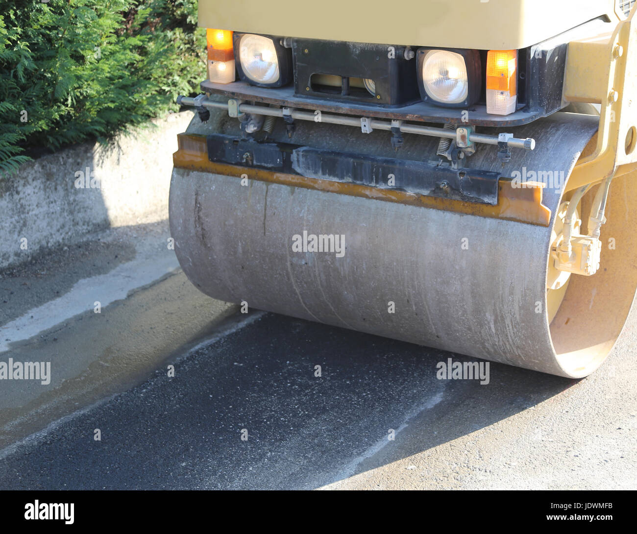steamroller during the asphalt laying on the road construction site ...