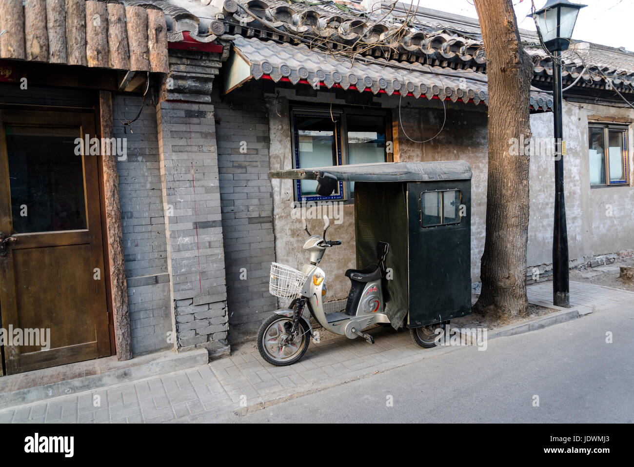 Auto rickshaw parked in front of house, Nanluoguxiang, neighbourhood ...