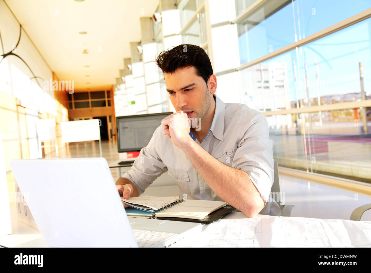 Young man studying at university Stock Photo - Alamy