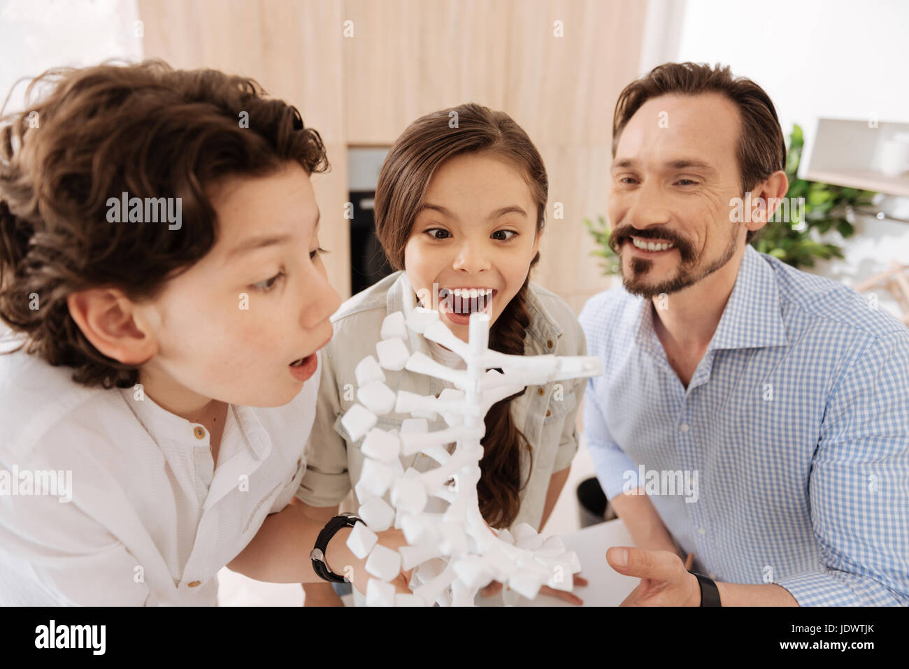 Father and kids being happy about new DNA model Stock Photo - Alamy