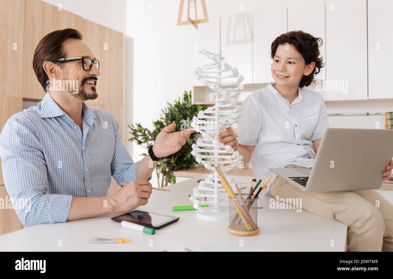 Father and his son discussing DNA structure Stock Photo - Alamy