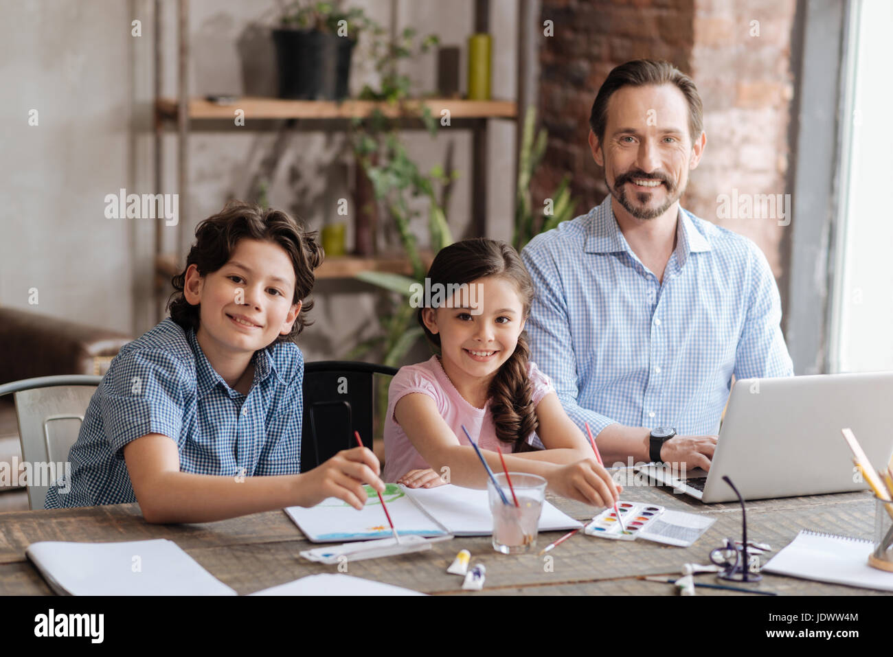 Happy family being lined up for a photo Stock Photo - Alamy