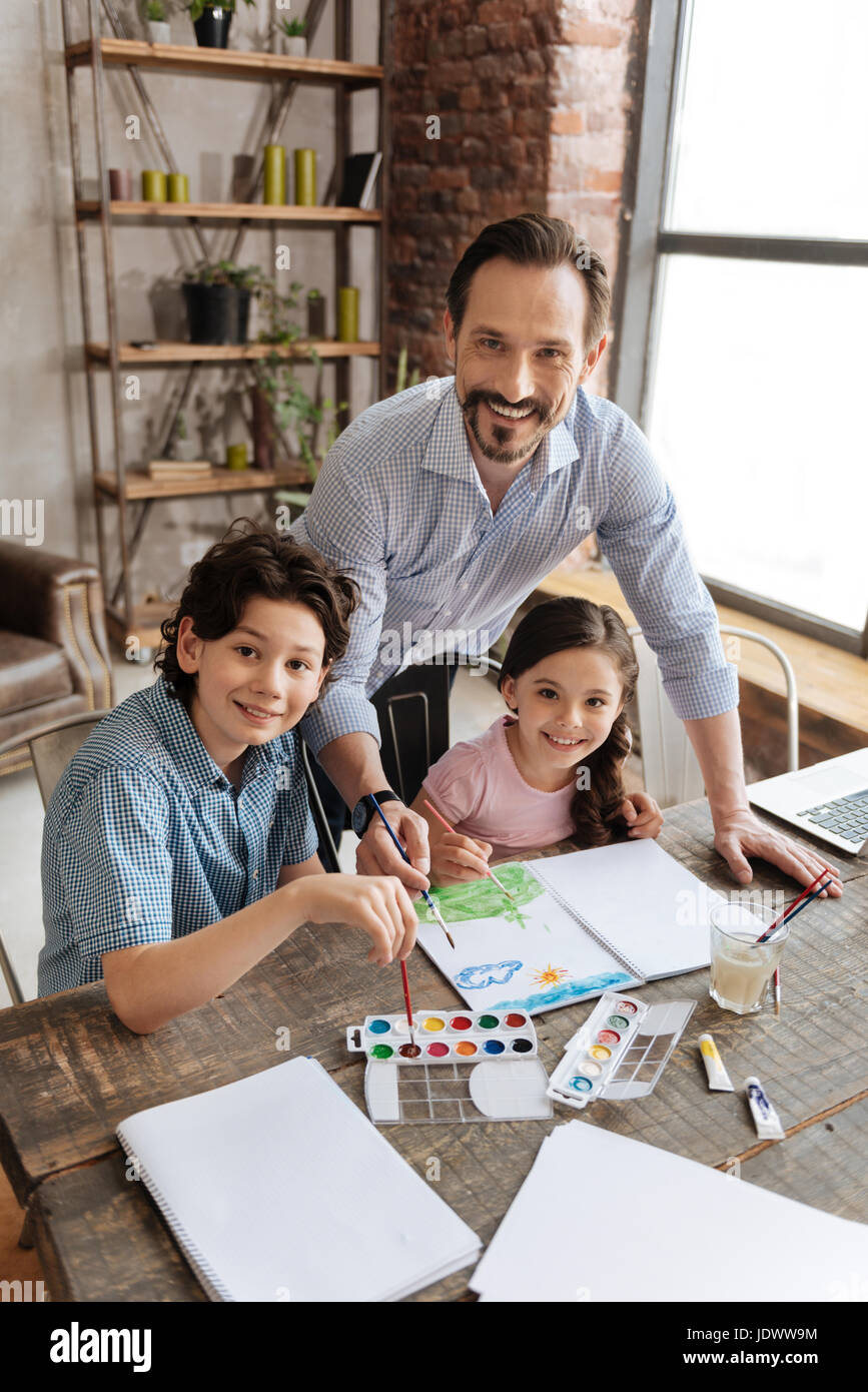 Happy single-parent family creating a landscape picture Stock Photo - Alamy