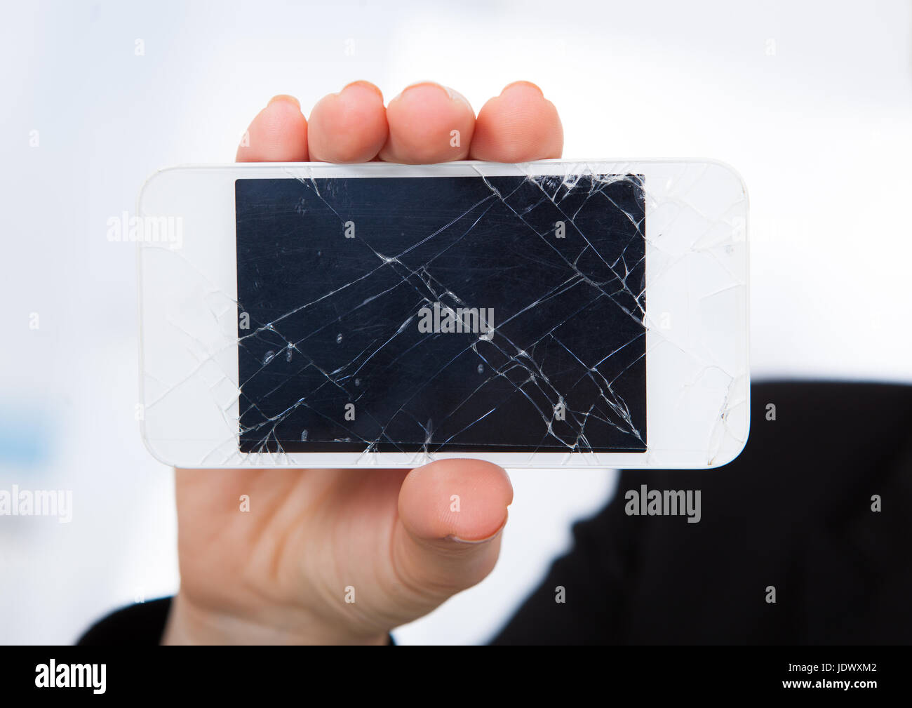 Close-up Of Hand Holding Smartphone With Cracked Screen Stock Photo - Alamy