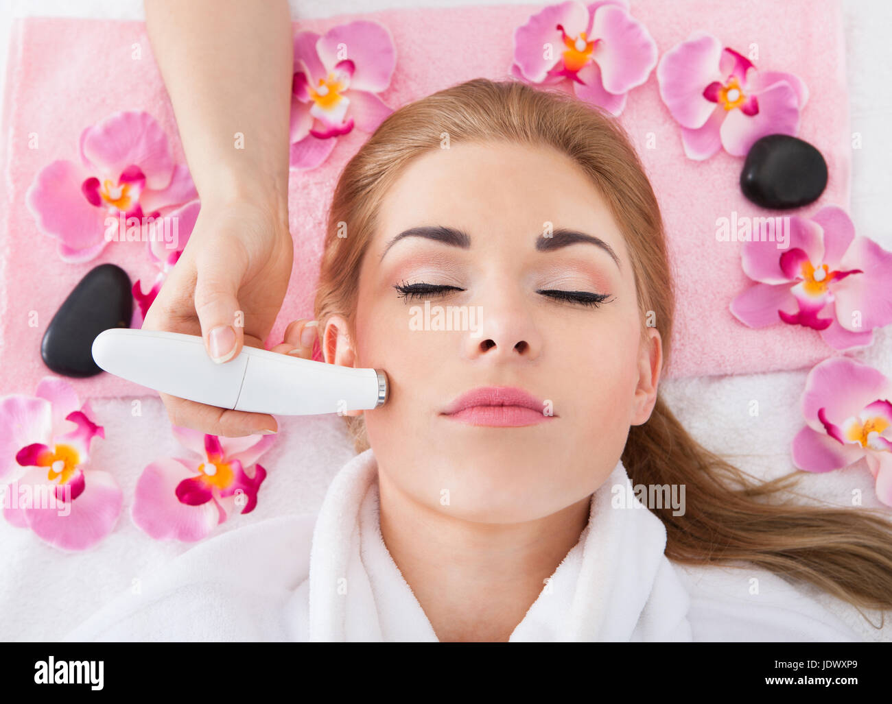 High Angle View Of Woman Getting Microdermabrasion Therapy In Spa Stock ...