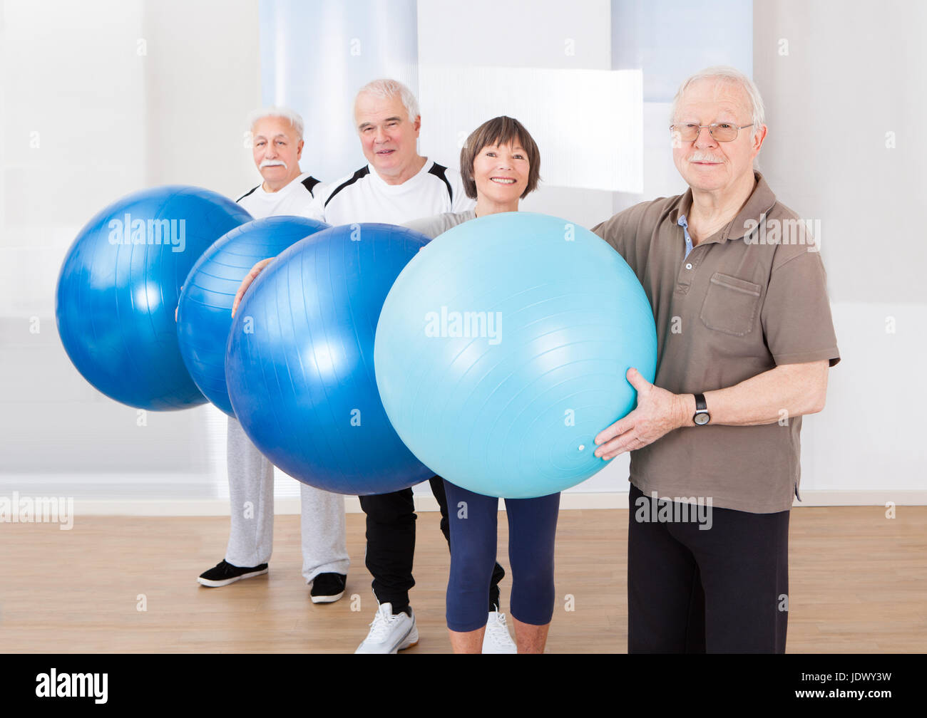 Elderly holding fitness balls hi-res stock photography and images - Alamy