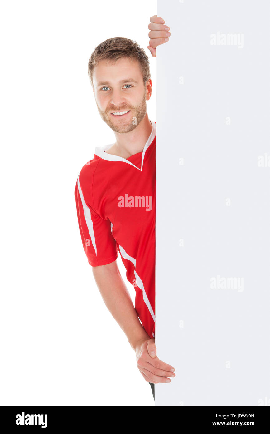 Portrait of mid adult man holding billboard over white background Stock ...