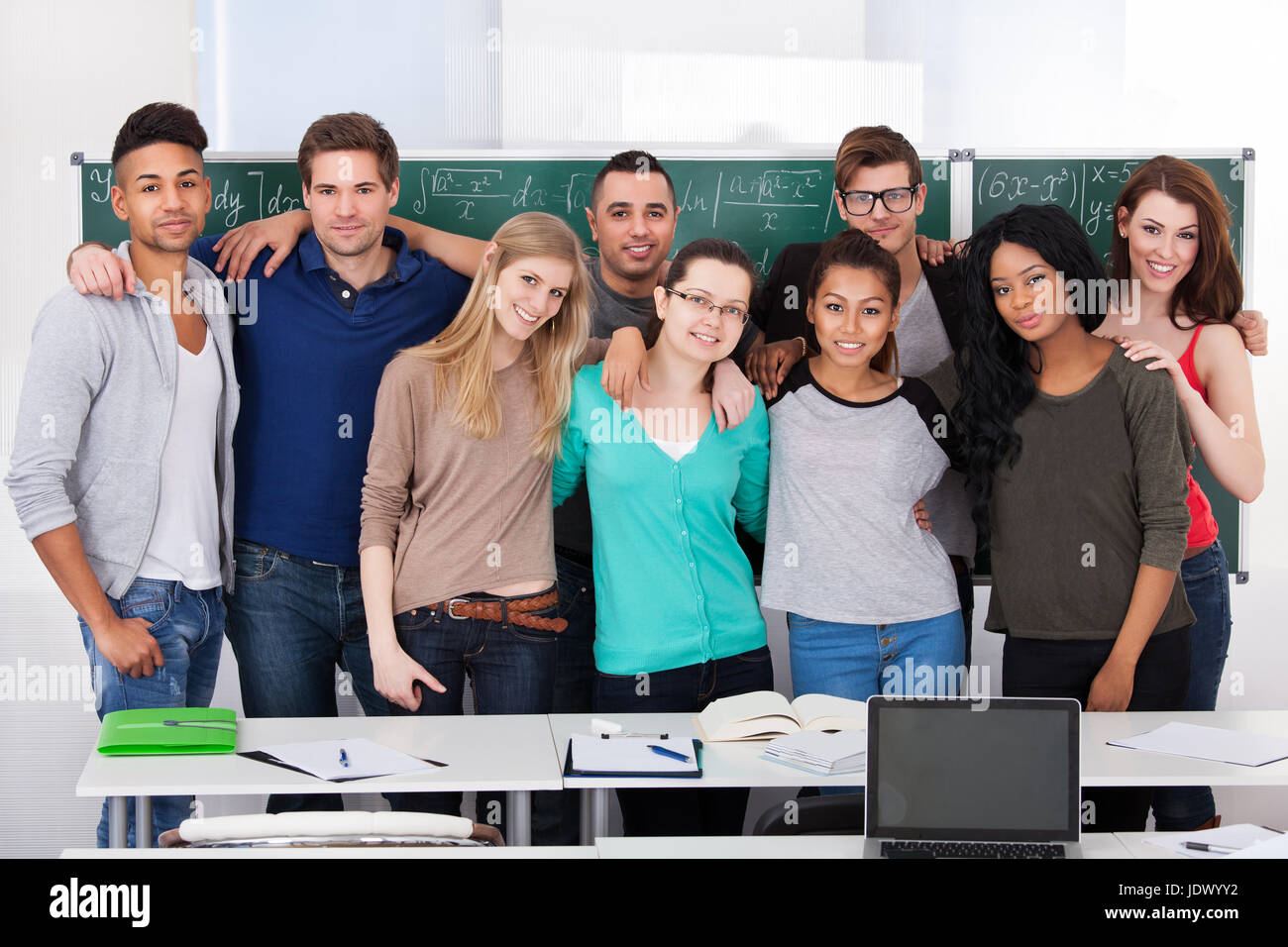 Group portrait of confident multiethnic college students standing ...