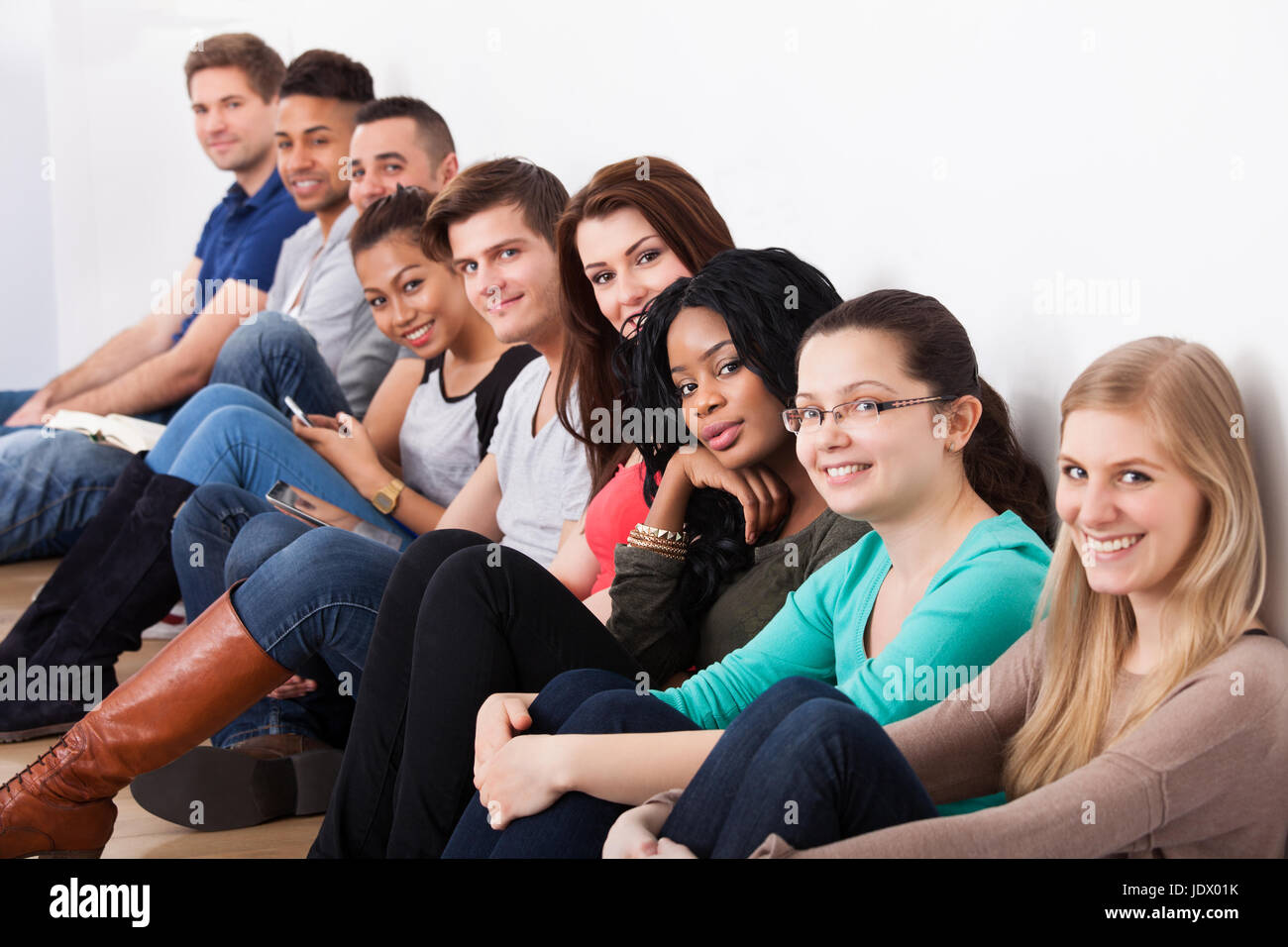 Hispanic sitting on floor classroom hi-res stock photography and images ...