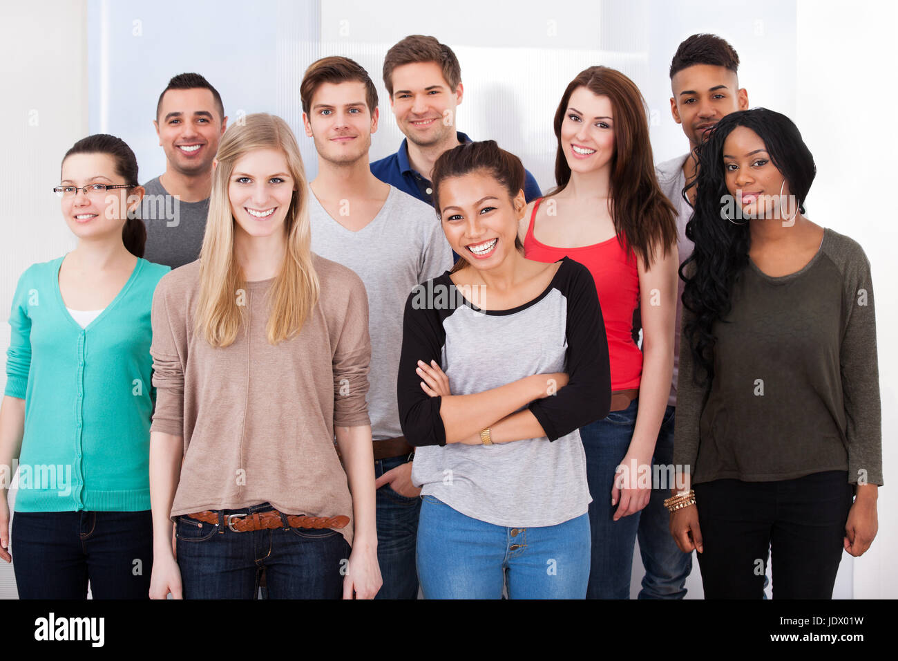 Group portrait of confident multiethnic college students standing ...