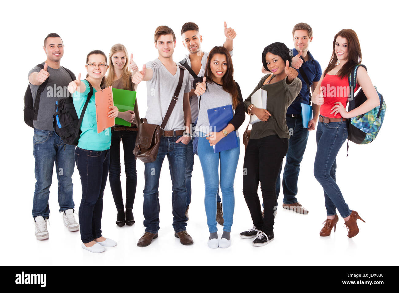 Full length portrait of confident college students standing together ...