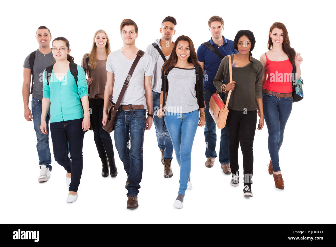 Full length portrait of confident university students walking over ...